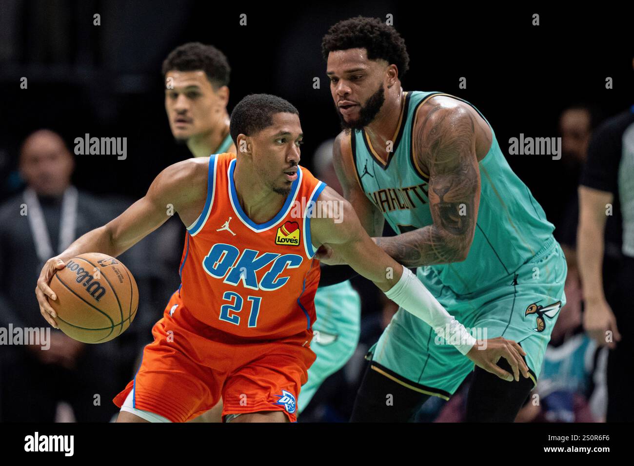 Charlotte Hornets forward Miles Bridges (0) guards Oklahoma City Thunder guard Aaron Wiggins (21 ...
