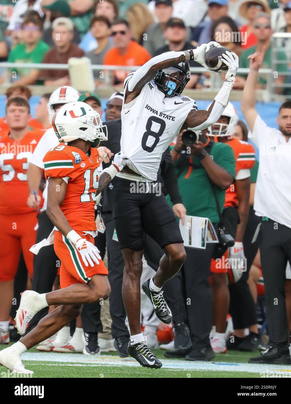 Orlando, FL, USA. 28th Dec, 2024. Iowa State's Isaiah Alston (8) grabs ...