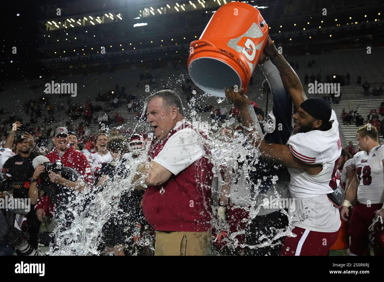 Miami (Ohio) defensive lineman Kobe Hilton (96) gives head coach Chuck ...