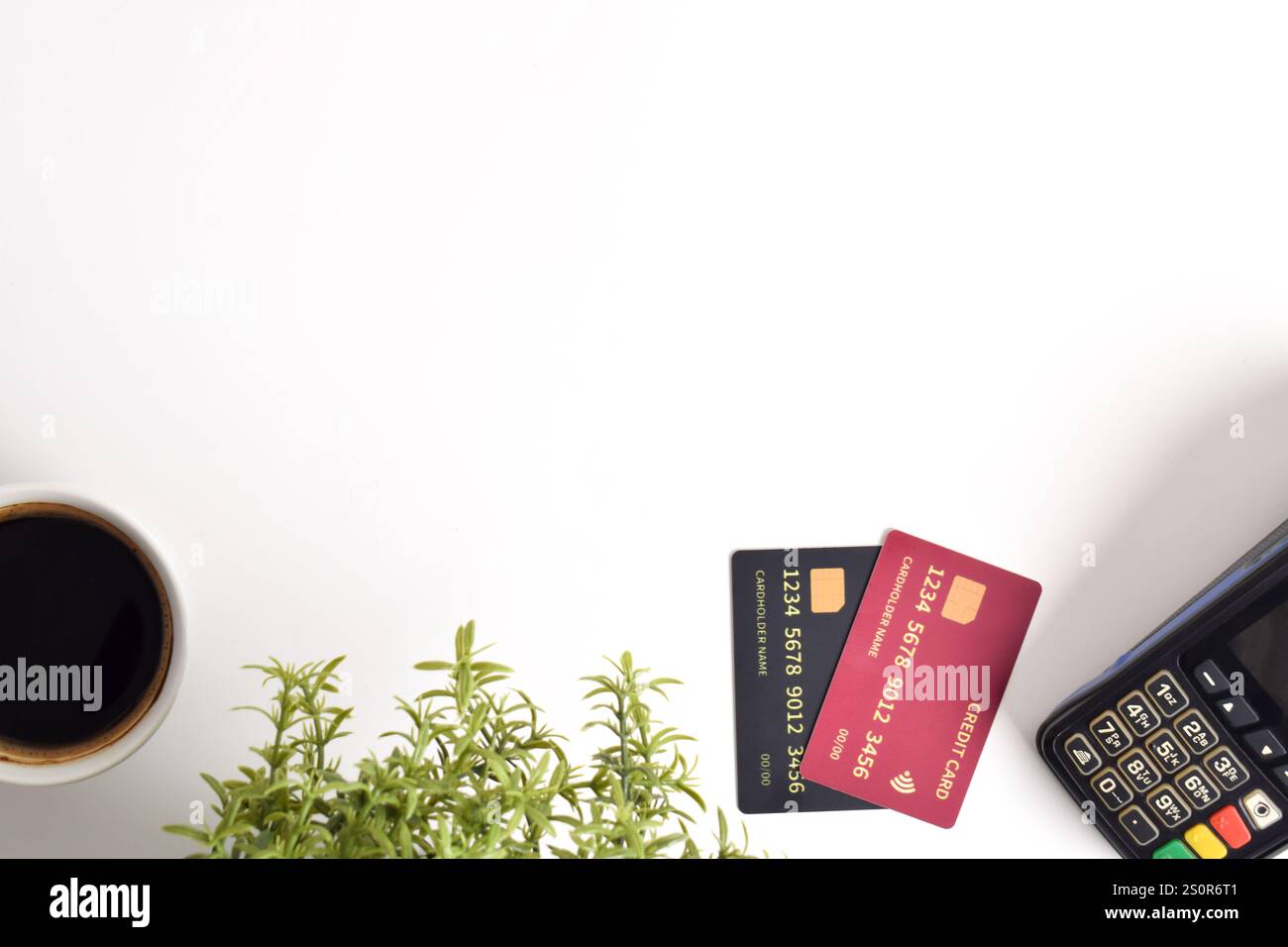 Payment terminal and credit cards on table, top view with copy space ...
