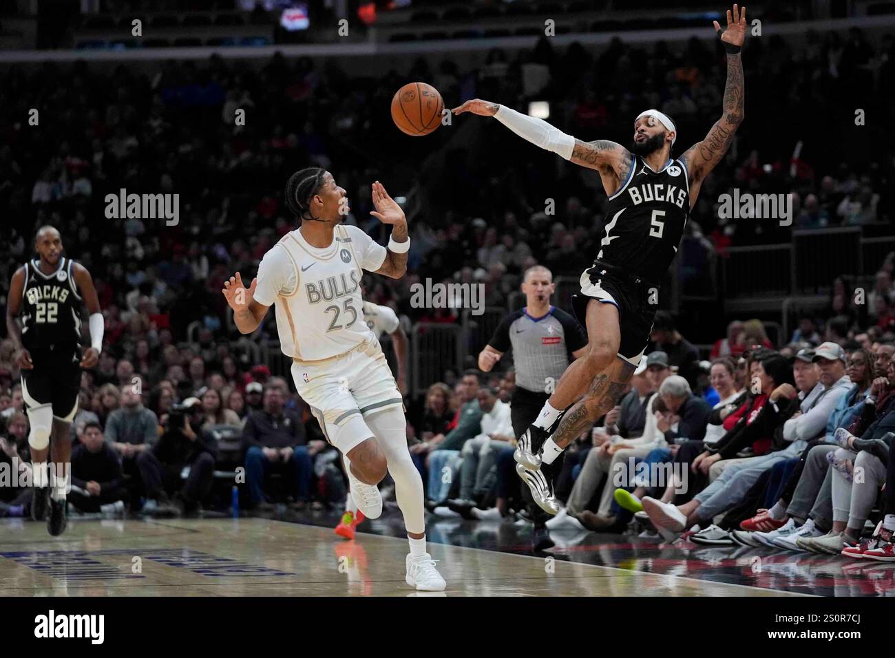 Milwaukee Bucks guard Gary Trent Jr., right, throws the ball over ...