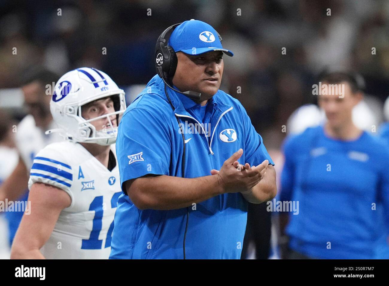 BYU head coach Kalani Sitake, center, watches from the sideline during ...