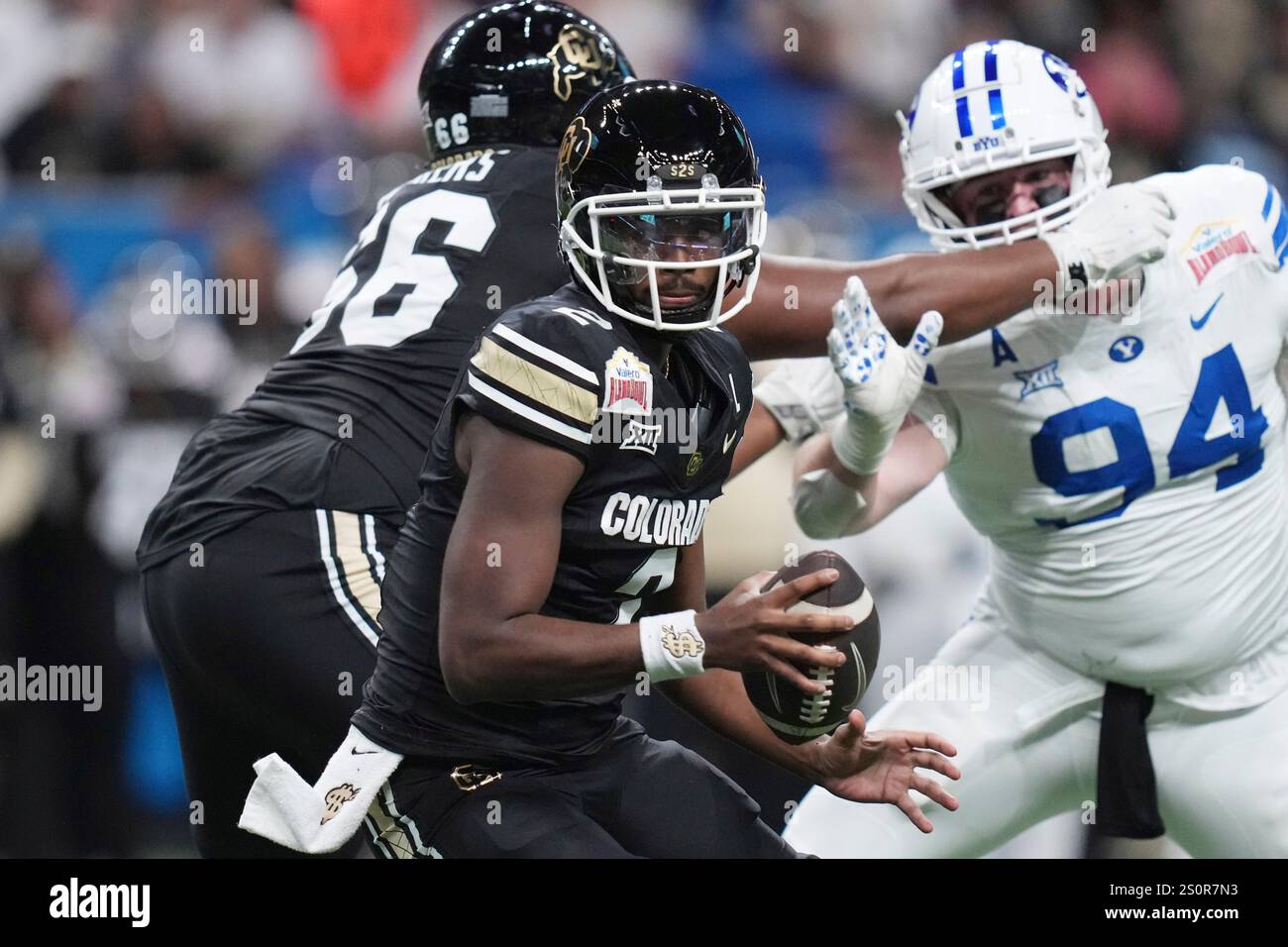 Colorado quarterback Shedeur Sanders (2) scrambles against BYU during ...