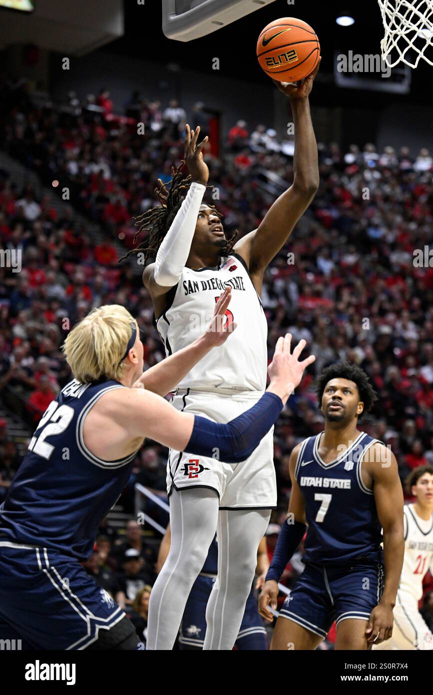 San Diego State forward Pharaoh Compton (5) shoots as Utah State ...