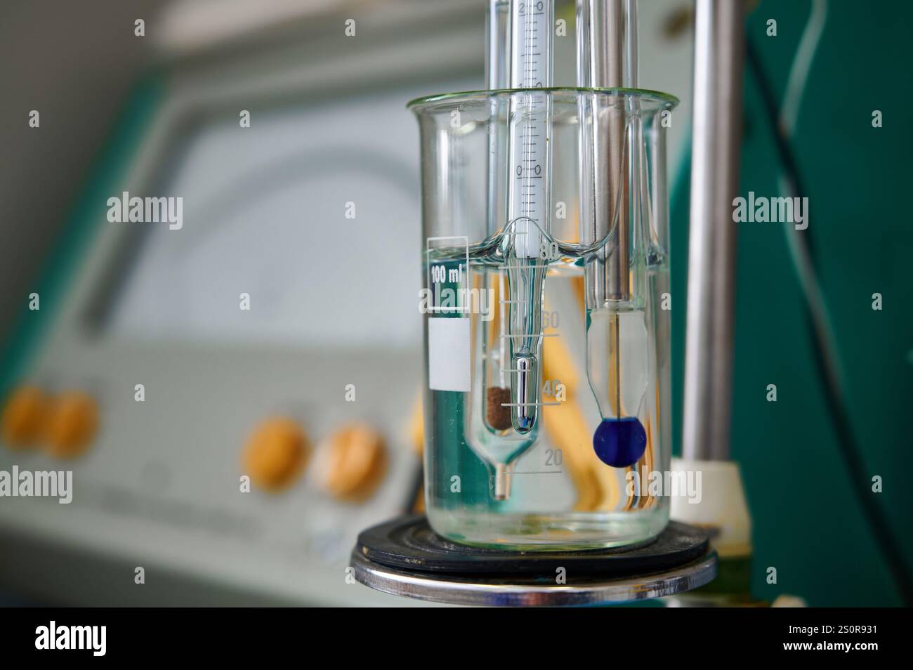 Laboratory setup with beaker containing liquid and measuring ...