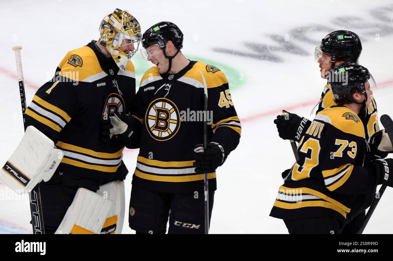 Boston Bruins forward Cole Koepke (45) celebrates with goalie Jeremy ...