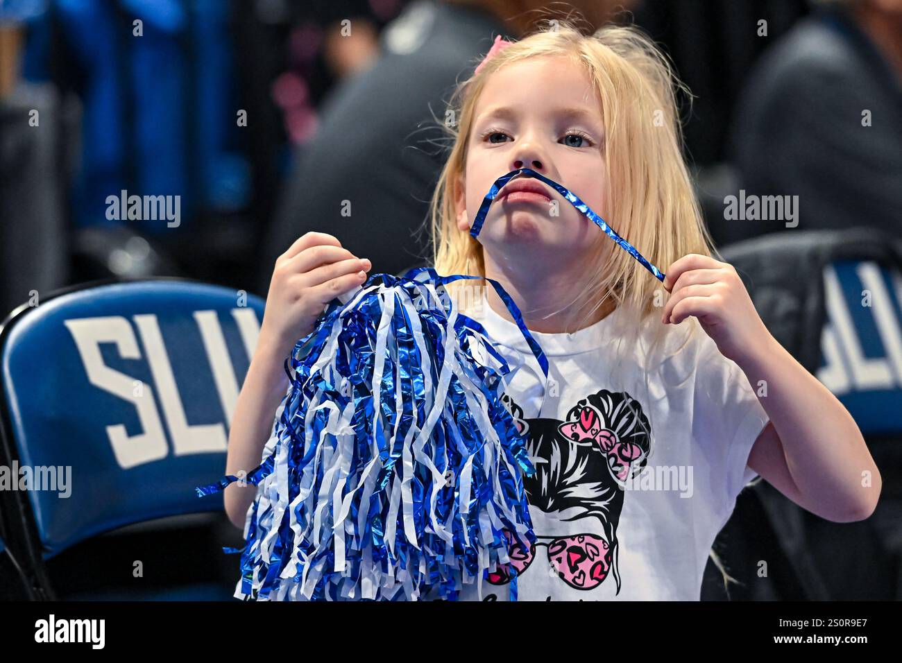 DECEMBER 28, 2024: A young Saint Louis fan struggles to watch the game ...
