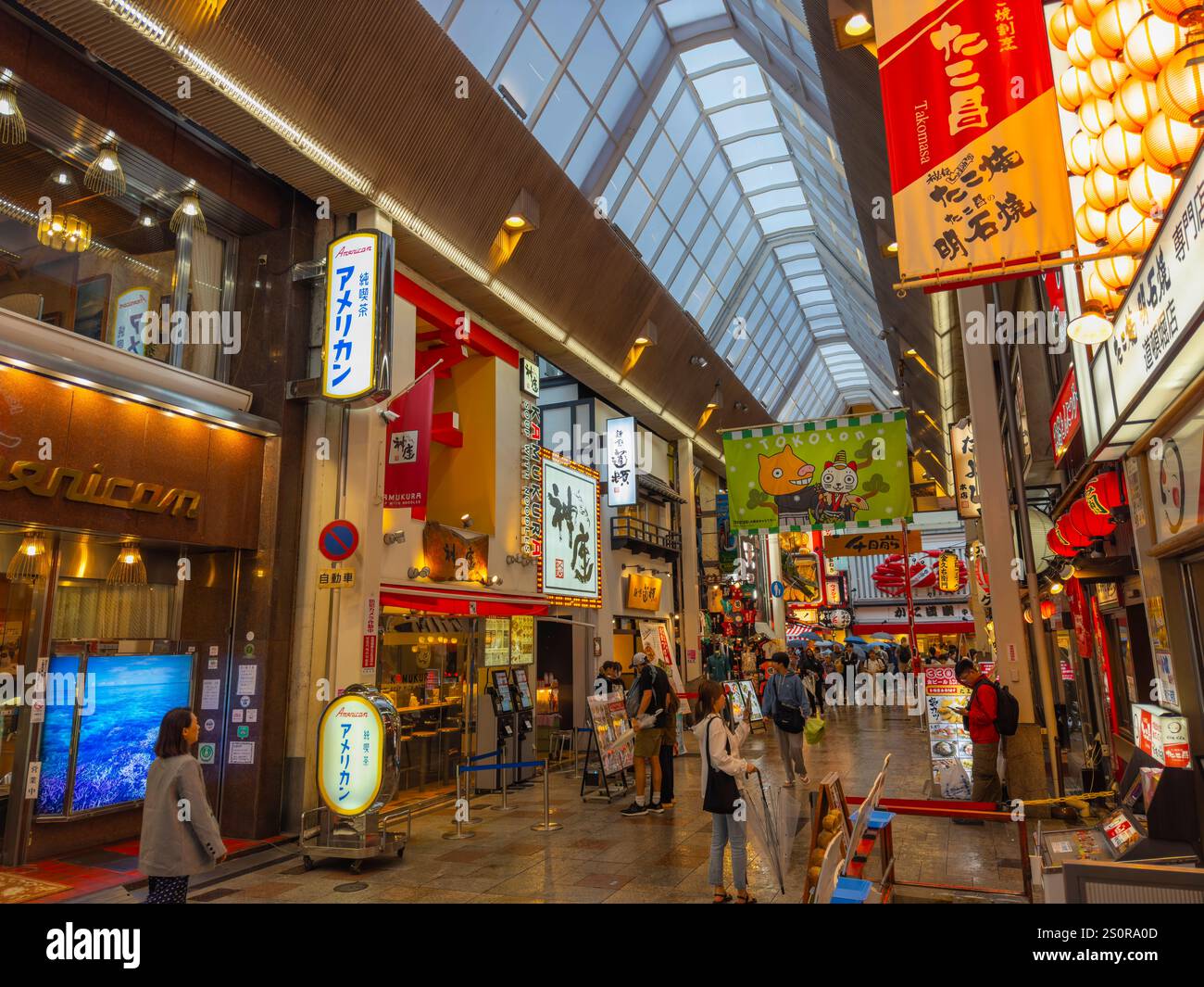Japanese style shops and restaurants on Sennichimae Street at Dotonbori ...