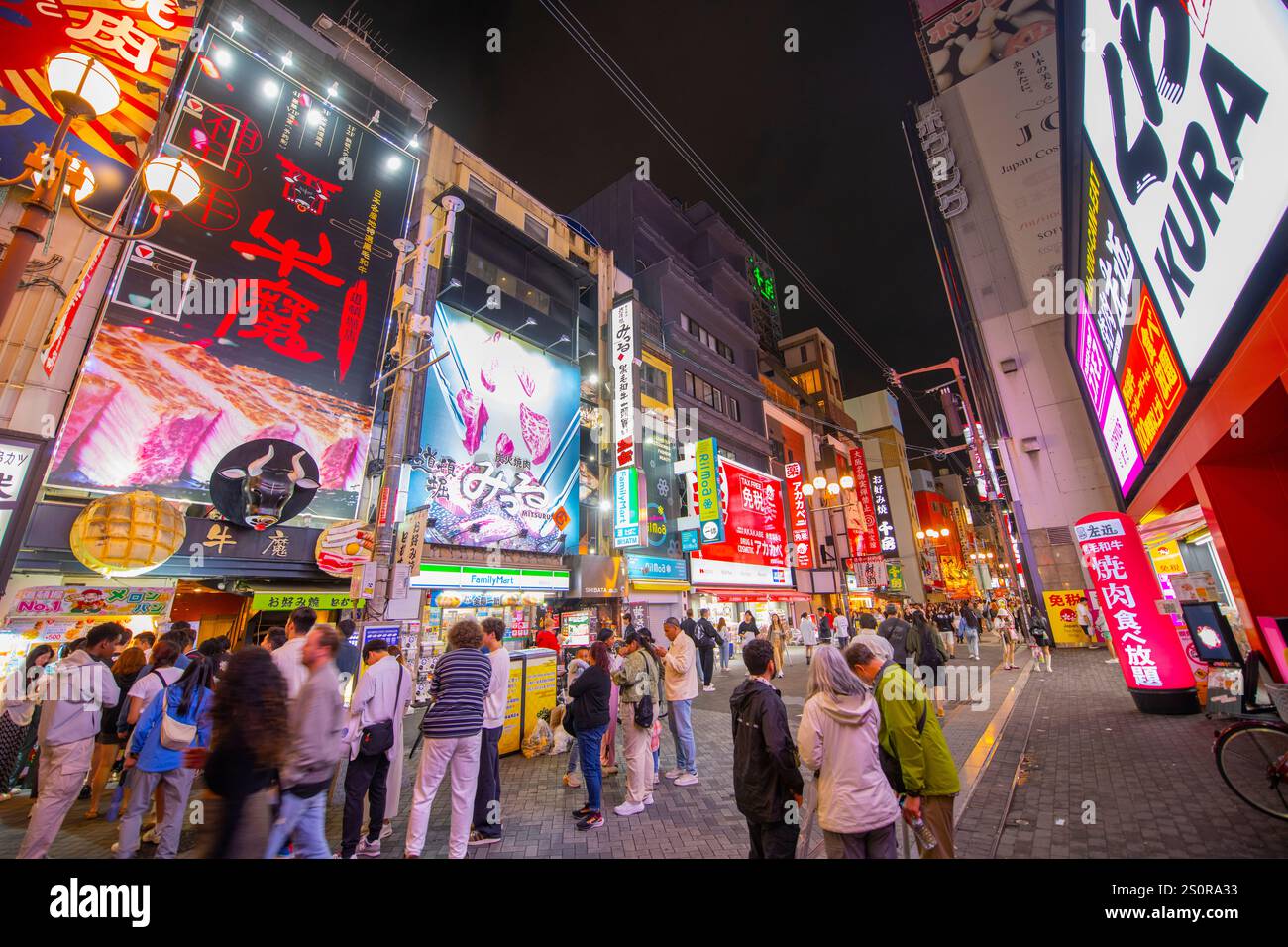 Modern commercial shops and restaurant at night on Dotonbori Street in ...
