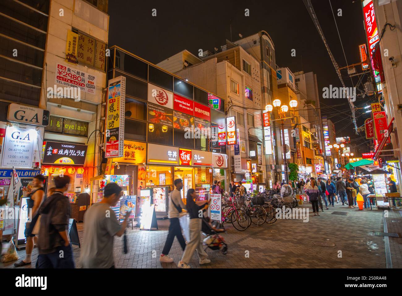 Modern commercial shops and restaurant at night on Dotonbori Street in ...