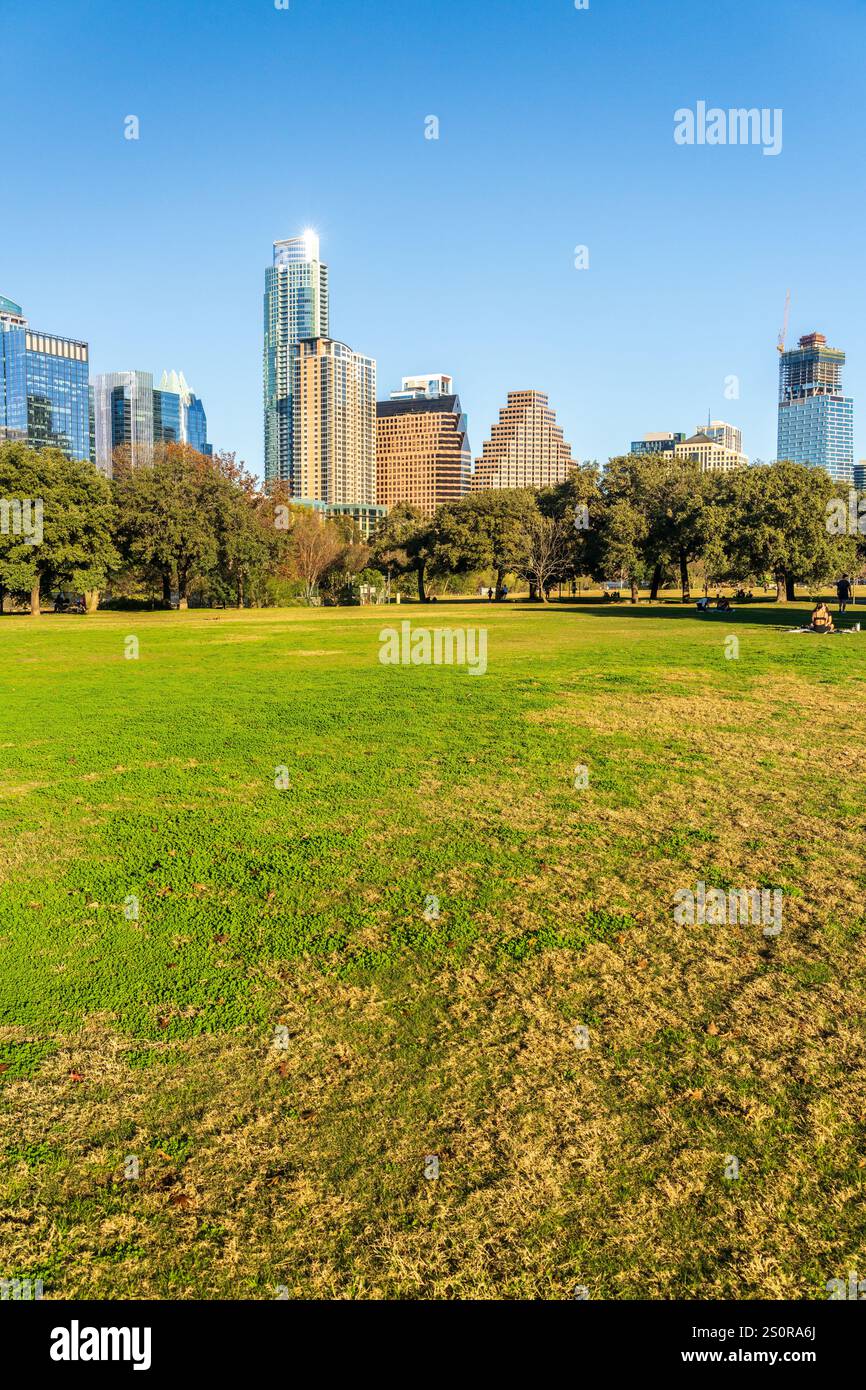 Modern apartment buildings and offices seen from open parkland in ...