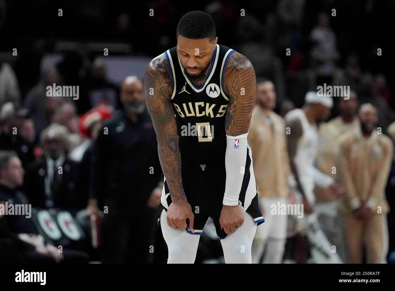 Milwaukee Bucks guard Damian Lillard reacts as his team falls behind ...