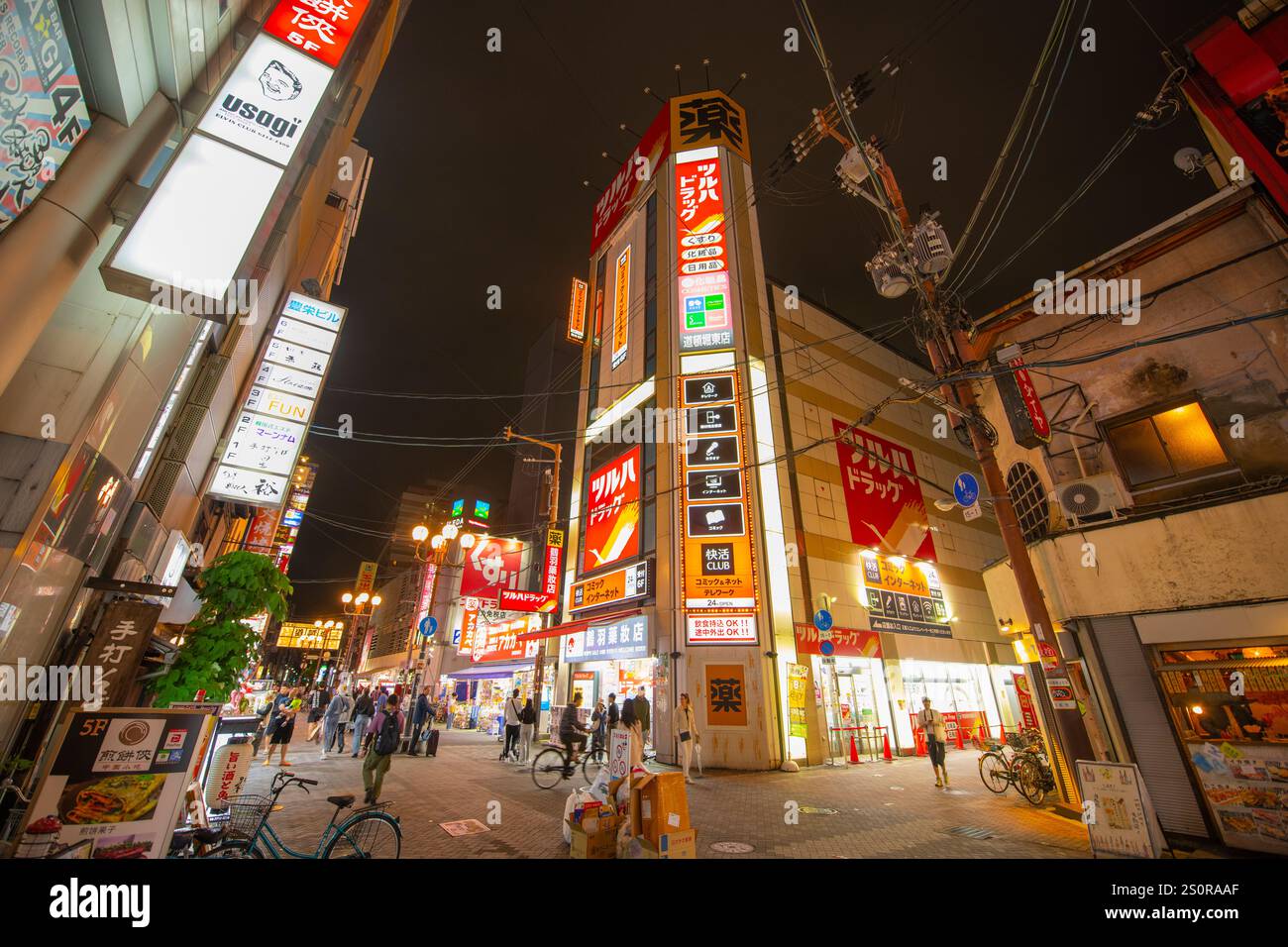 Modern commercial shops and restaurant at night on Dotonbori Street in ...