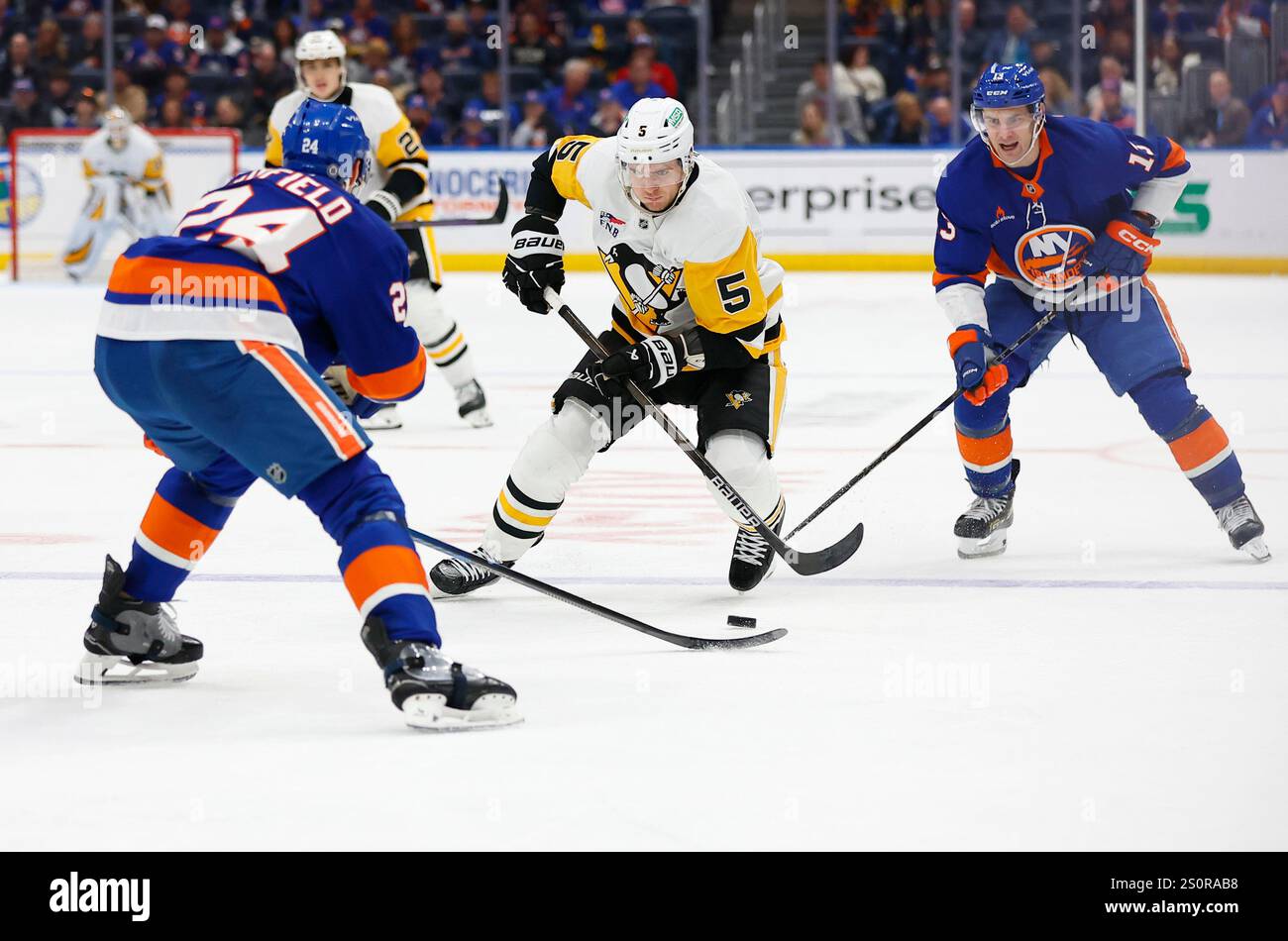 Pittsburgh Penguins defenseman Ryan Shea (5) skates with the puck ...