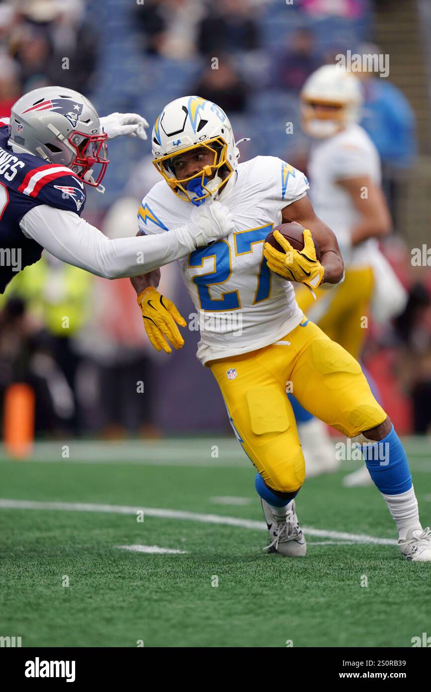 Los Angeles Chargers running back J.K. Dobbins (27) gets tackled by New ...