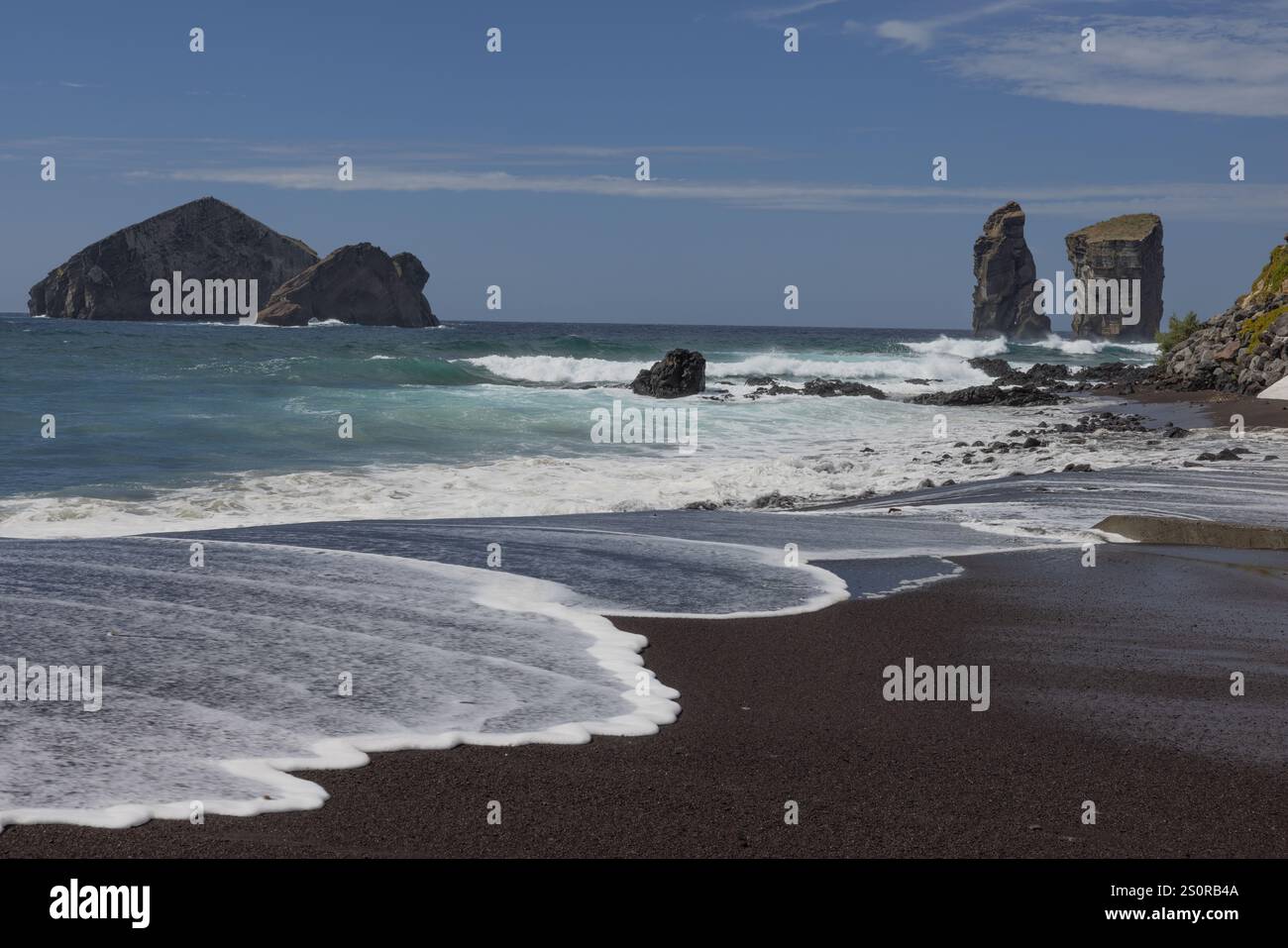 Black volcanic sands and ilhéus dos Mosteiros (Mosteiros islets) at ...
