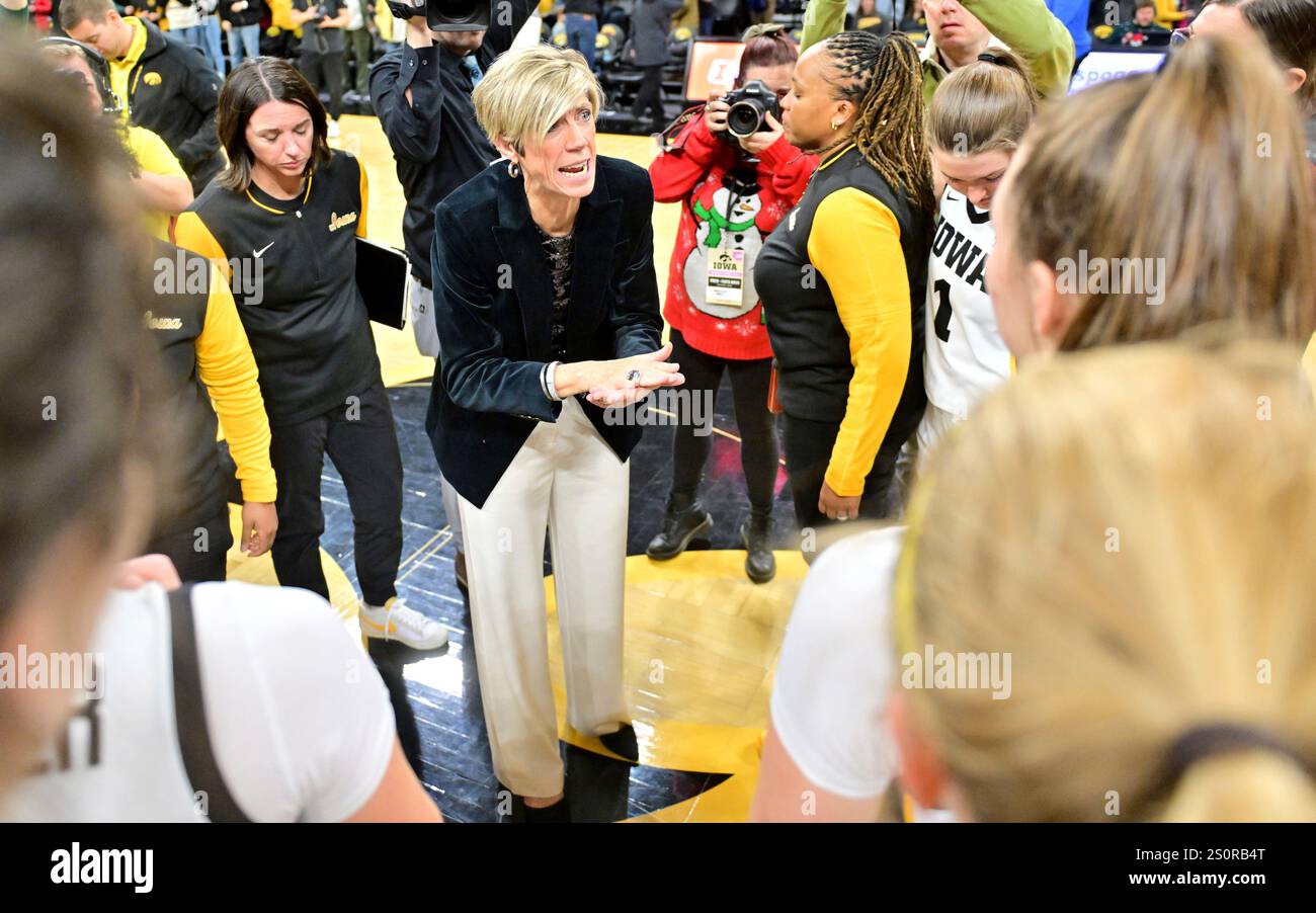 IOWA CITY, IA - DECEMBER 20: Iowa coach Jan Jenson talks to her team ...