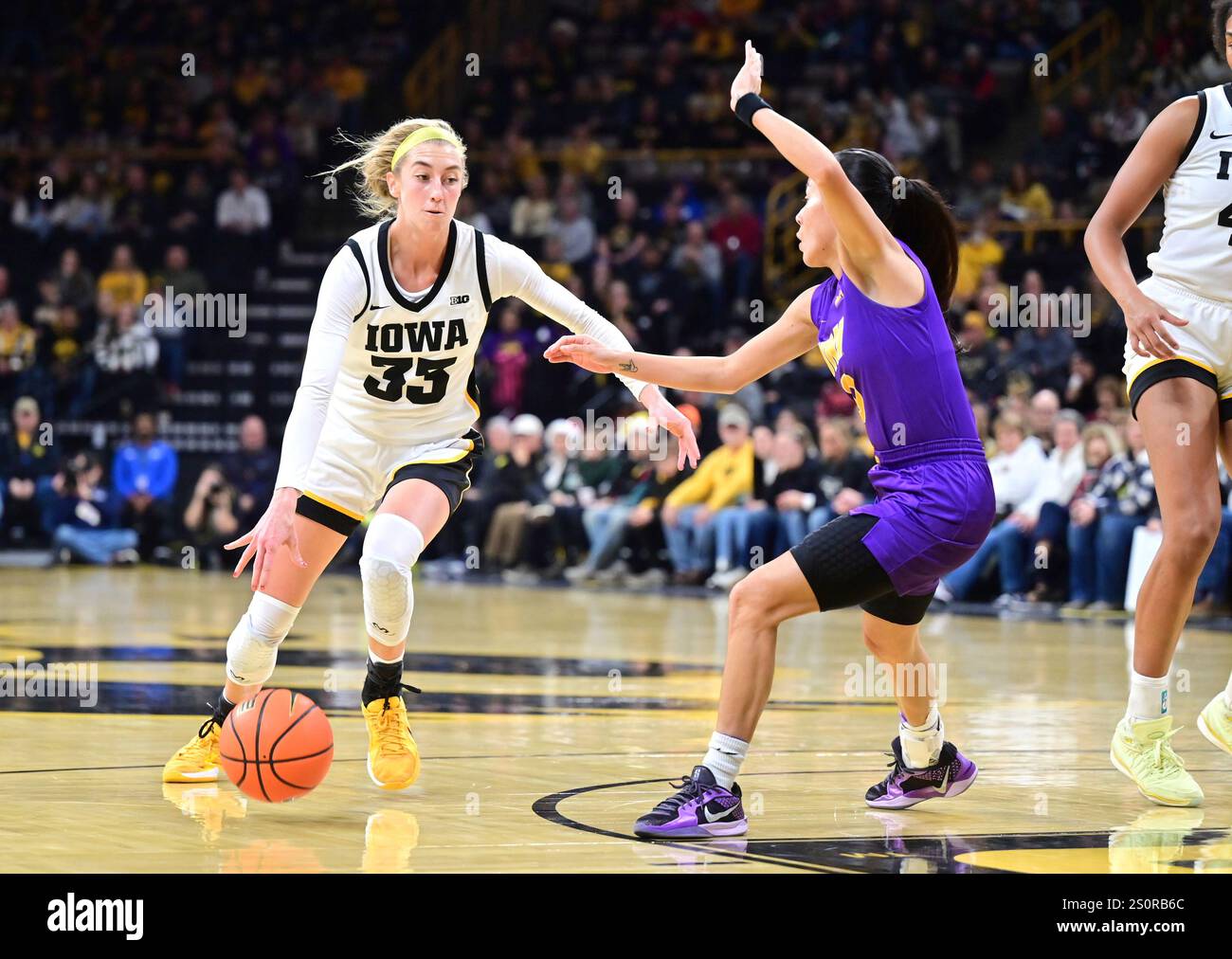 IOWA CITY, IA - DECEMBER 20: Iowa guard Lucy Olsen (33) drives to the ...