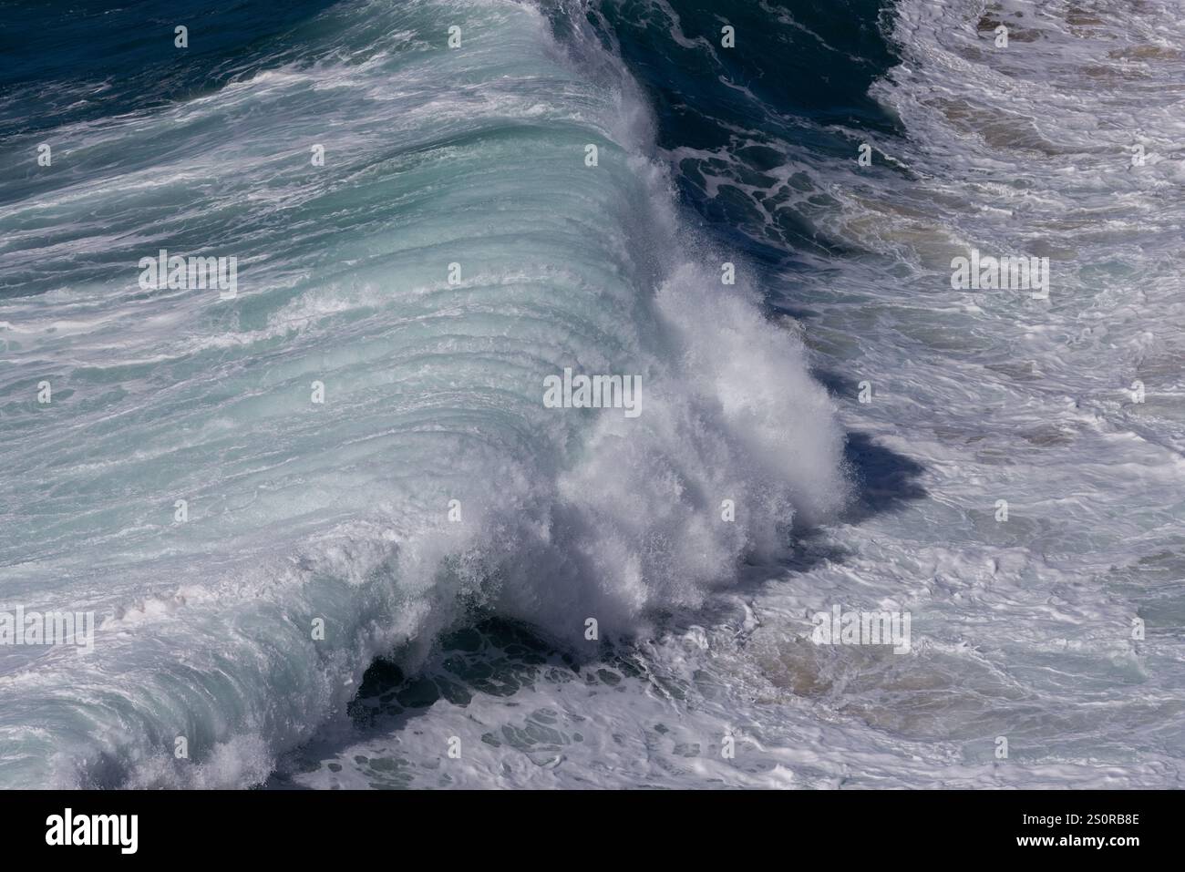 Breaking wave along the coast at Praia do Norte (North Beach) as seen ...