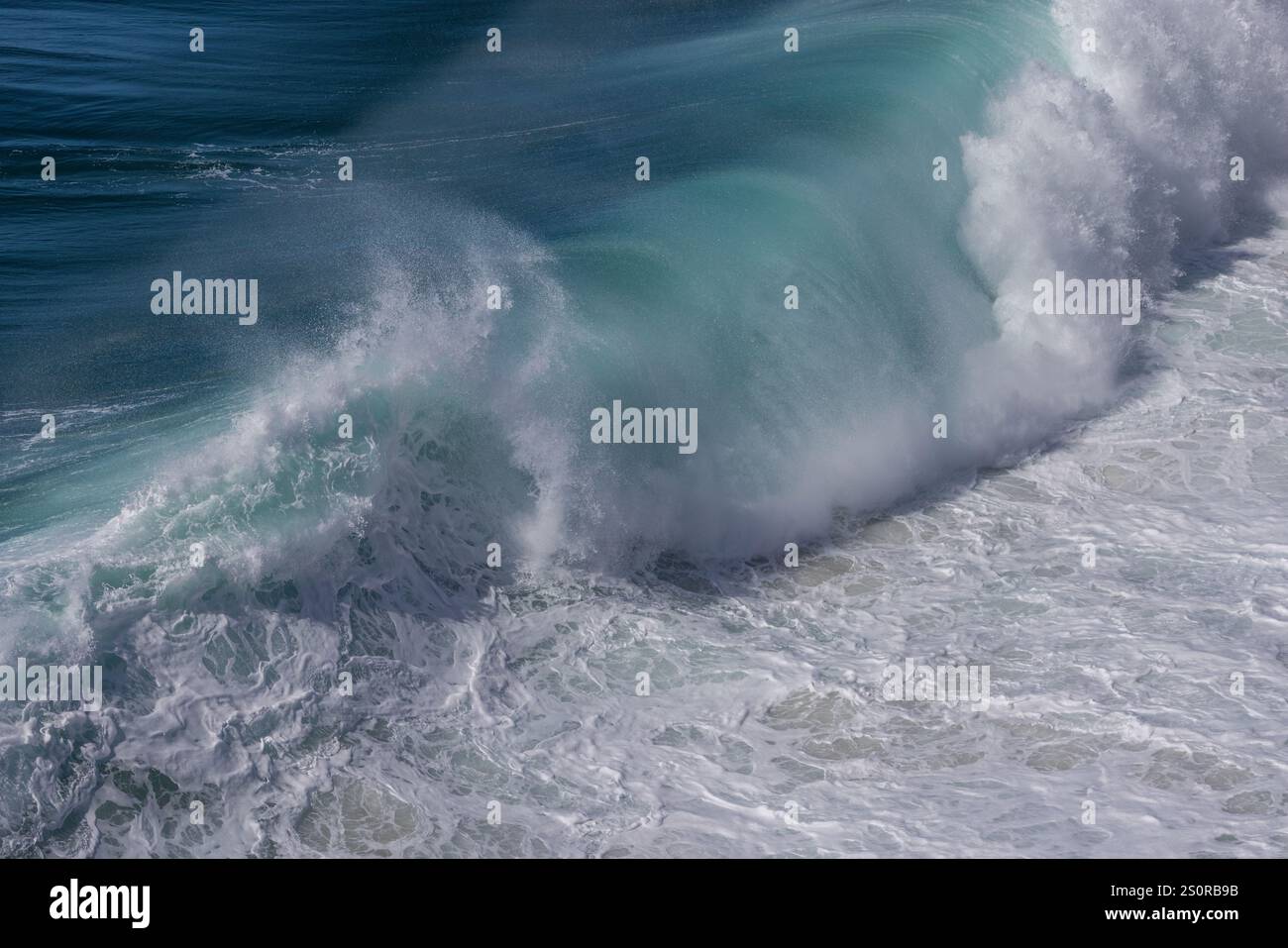Breaking windswept wave along the coast at Praia do Norte (North Beach ...