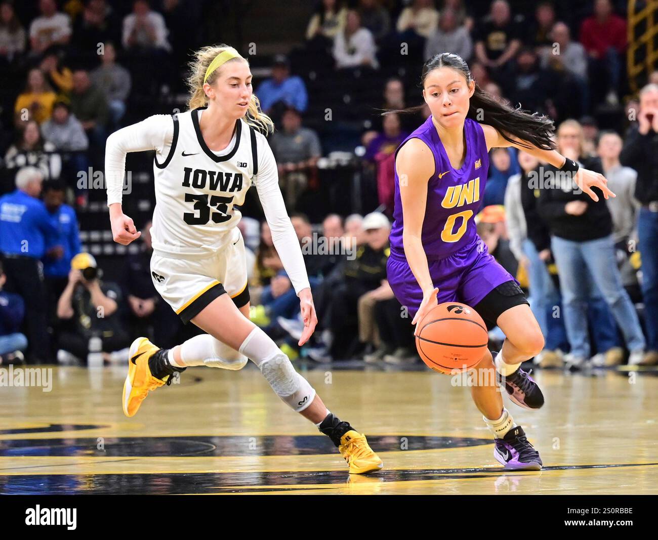 IOWA CITY, IA - DECEMBER 20: UNI guard Maya McDermott (0) drives to the ...