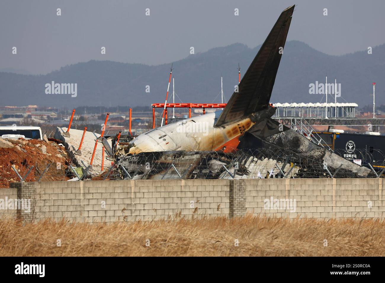 The debris are seen at the site of a plane fire at the Muan ...