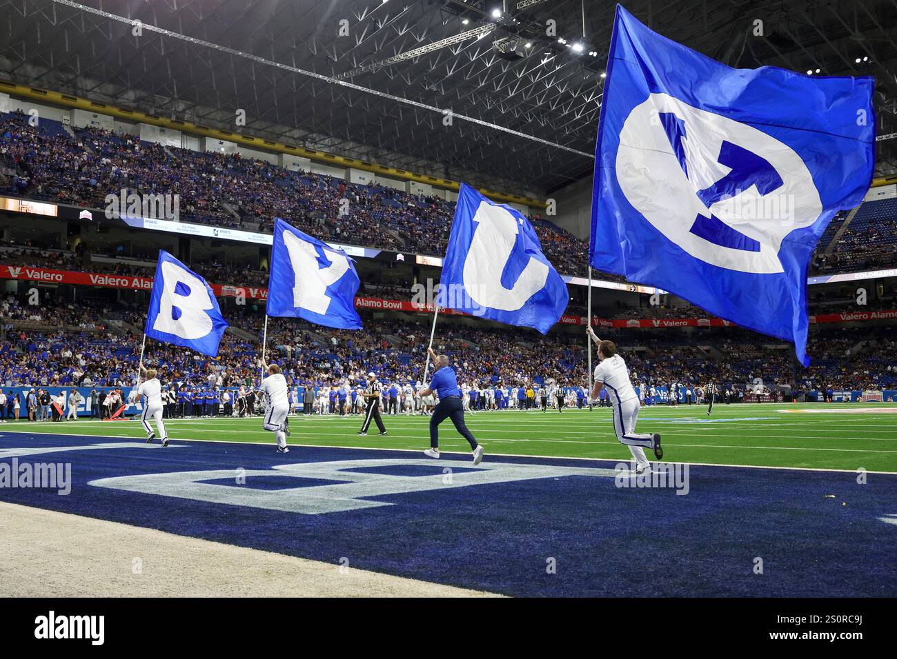 SAN ANTONIO, TX - DECEMBER 28: BYU flags are run across the end zone ...