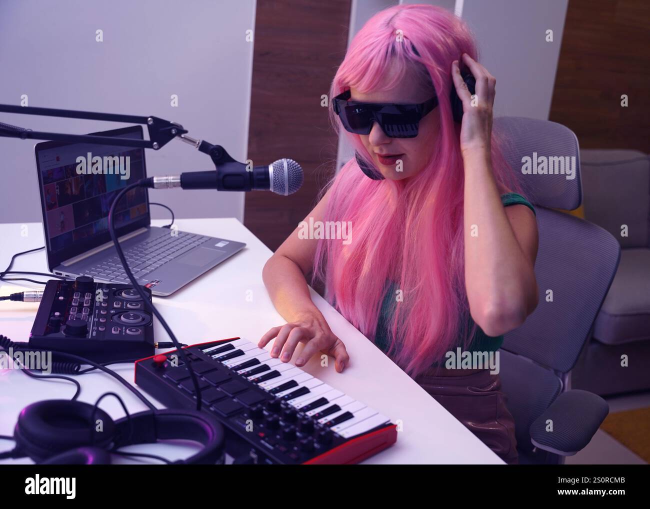Beautiful young singer and musician broadcast from her home studio ...