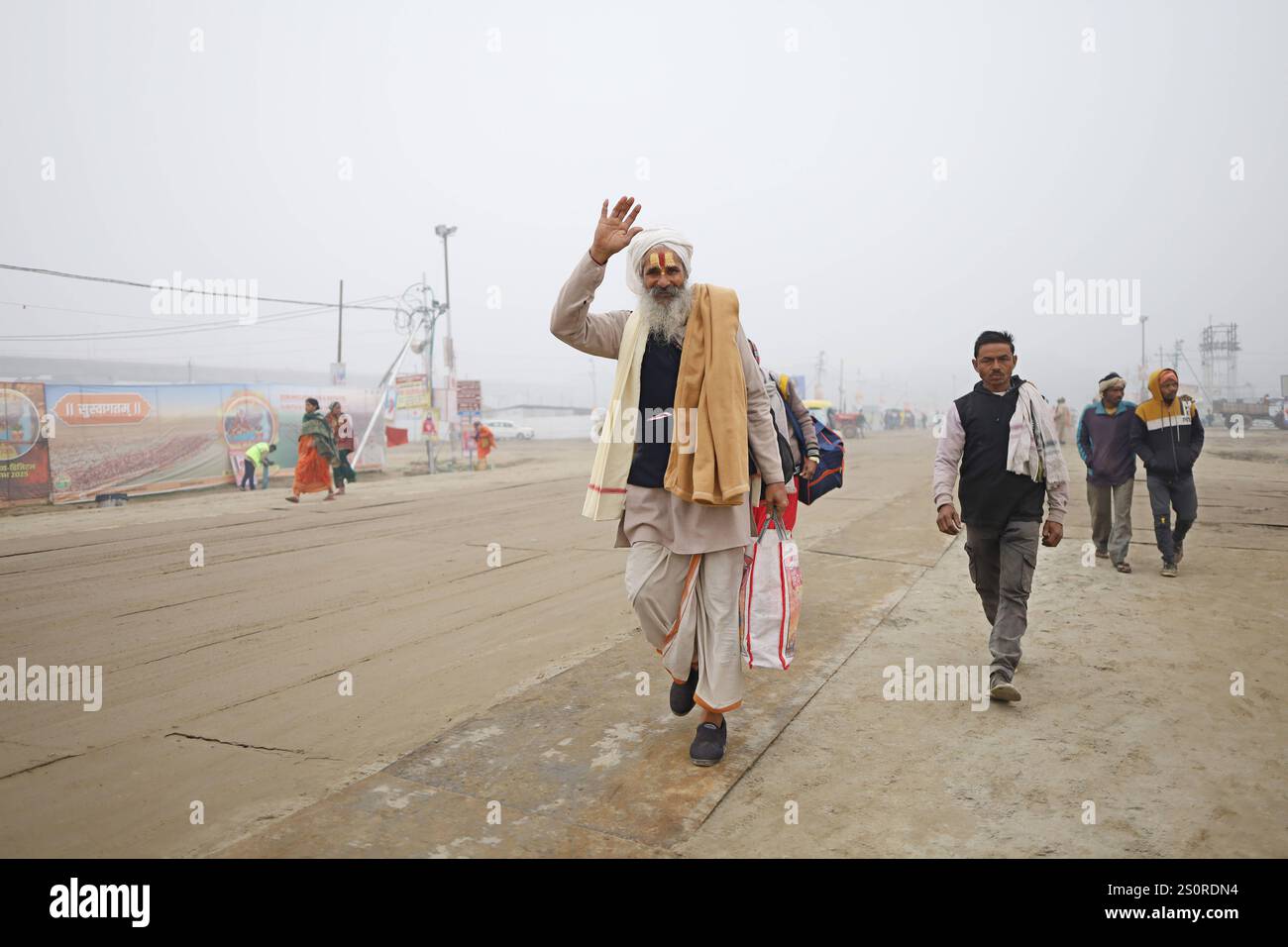 Holy men sage walk at the mela ground area at bank of Sangam confluence ...