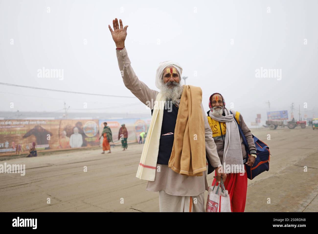 Holy men sage walk at the mela ground area at bank of Sangam confluence ...