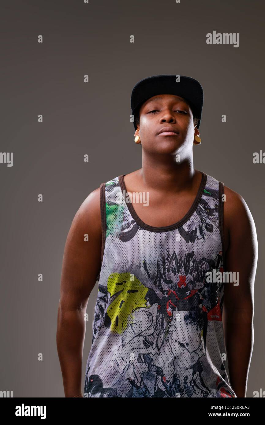 Studio portrait of a young african american musician wearing a tank top ...