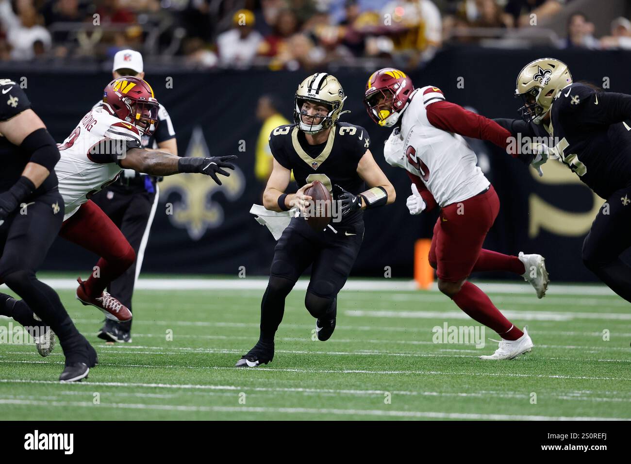 New Orleans Saints quarterback Jake Haener (3) runs the ball during an ...