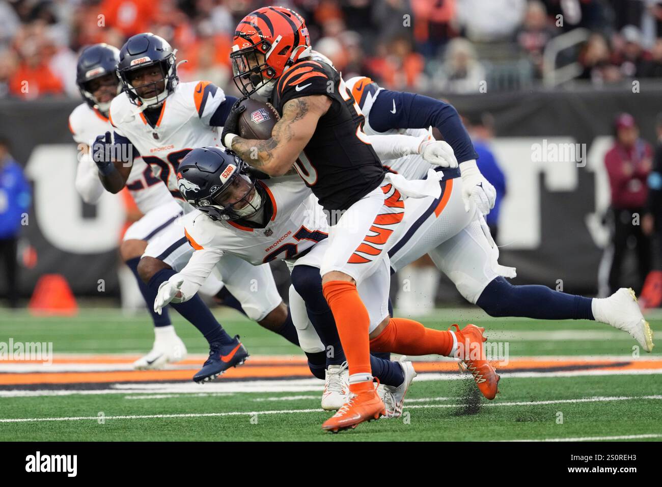 Cincinnati Bengals running back Chase Brown carries the ball as Denver ...