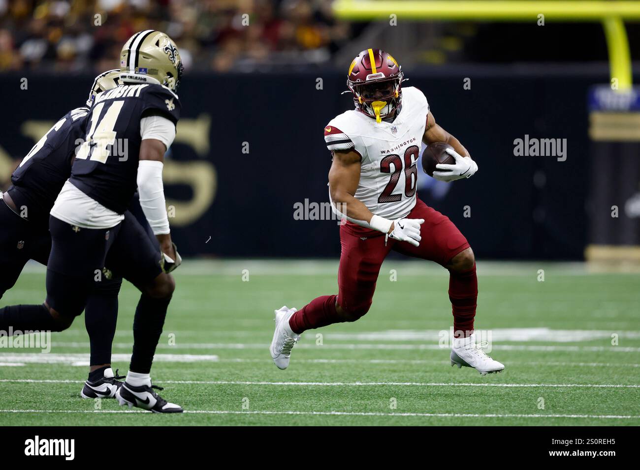 Washington Commanders running back Jeremy McNichols (26) runs the ball ...