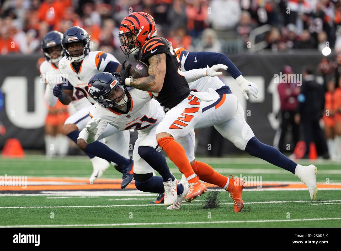 Cincinnati Bengals running back Chase Brown carries the ball as Denver ...