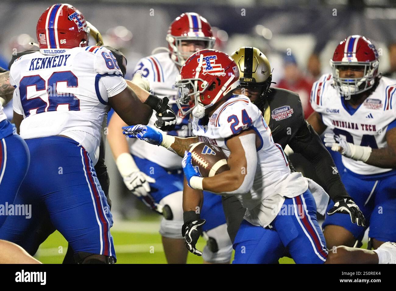 Louisiana Tech running back Fred Robertson (24) follows his blockers as ...
