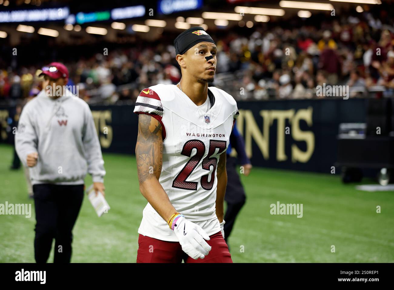 Washington Commanders cornerback Benjamin St-Juste (25) warms up before ...