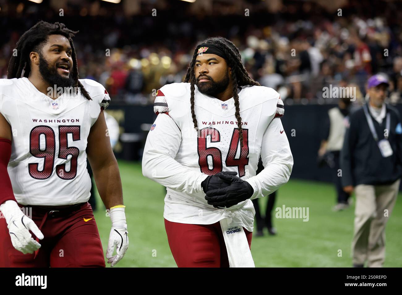 Washington Commanders defensive tackle Sheldon Day (64) warms up before ...