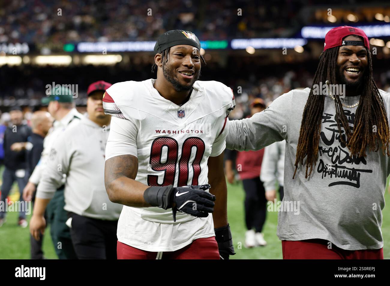 Washington Commanders defensive end Javontae Jean-Baptiste (90) warms ...