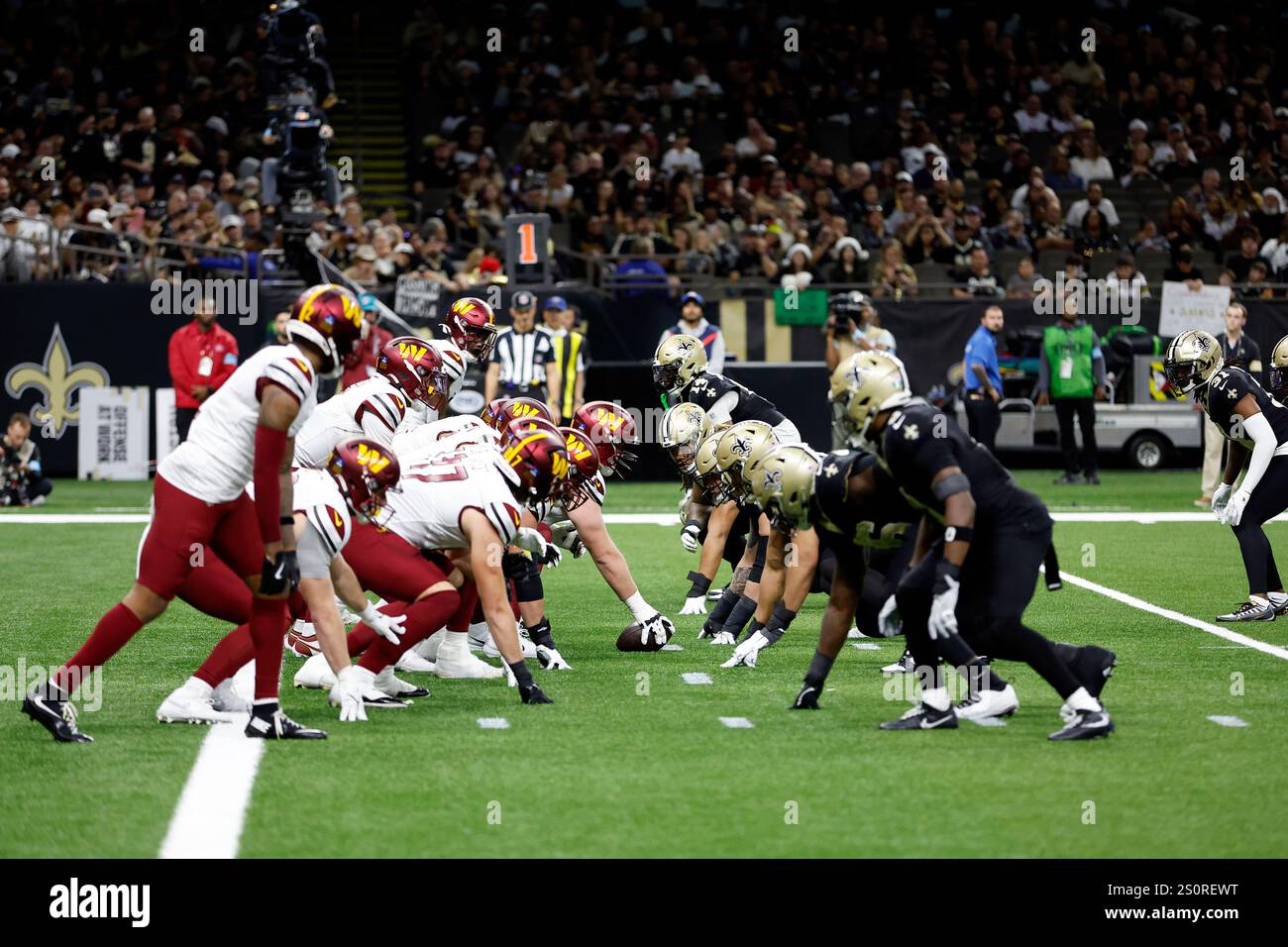 The Washington Commanders offense lines up at the line of scrimmage ...