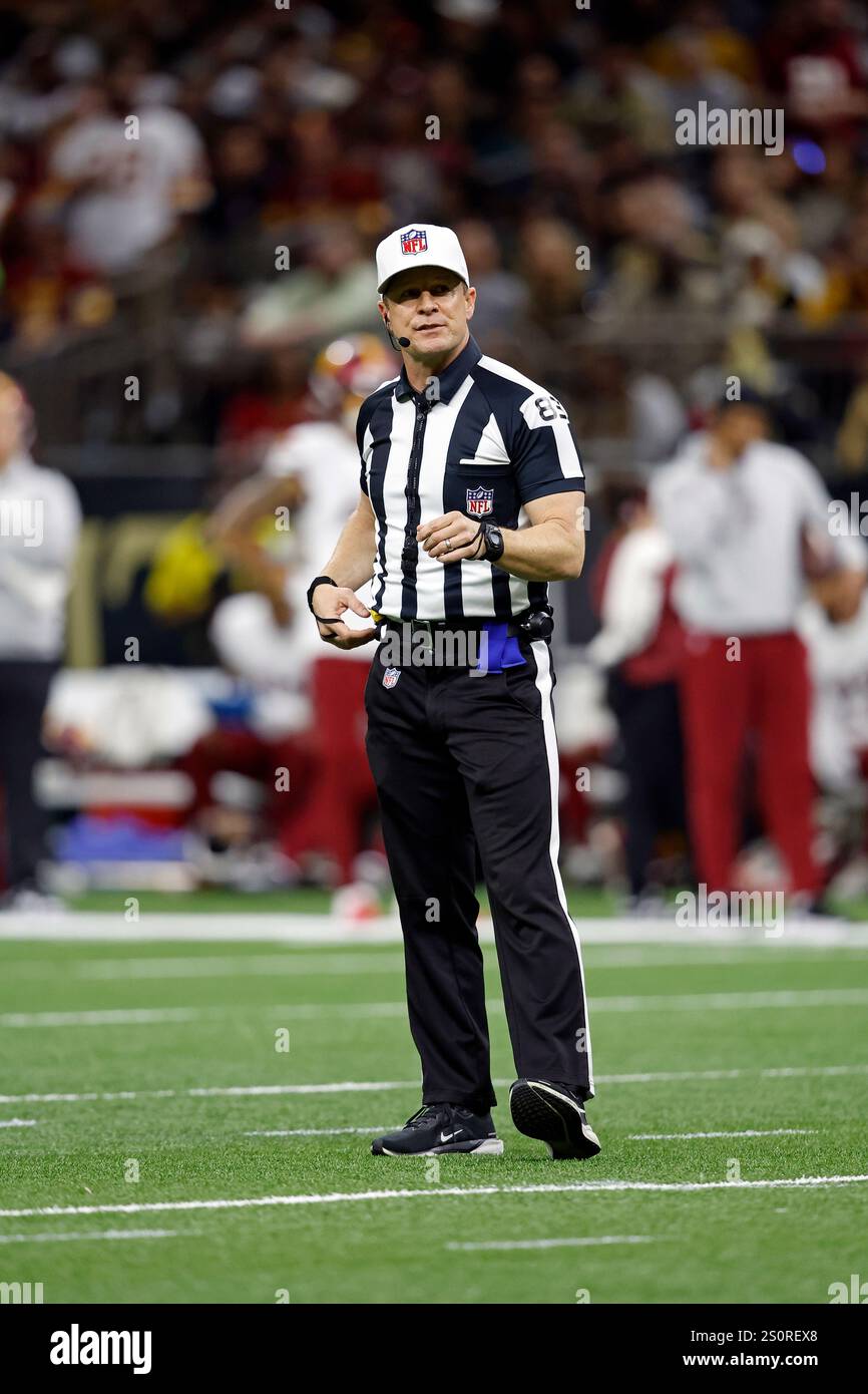 Referee Shawn Hochuli (83) makes a call during an NFL football game ...