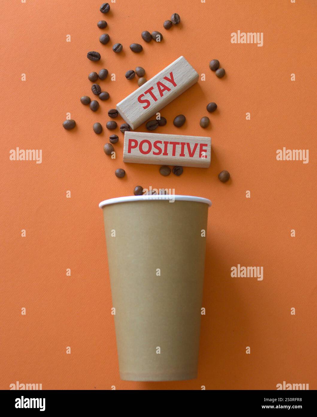 Stay Positive symbol. Concept word Stay Positive on wooden blocks ...