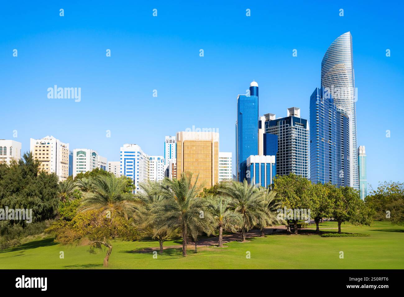 Corniche Park and Abu Dhabi city skyline. Abu Dhabi is the capital city ...