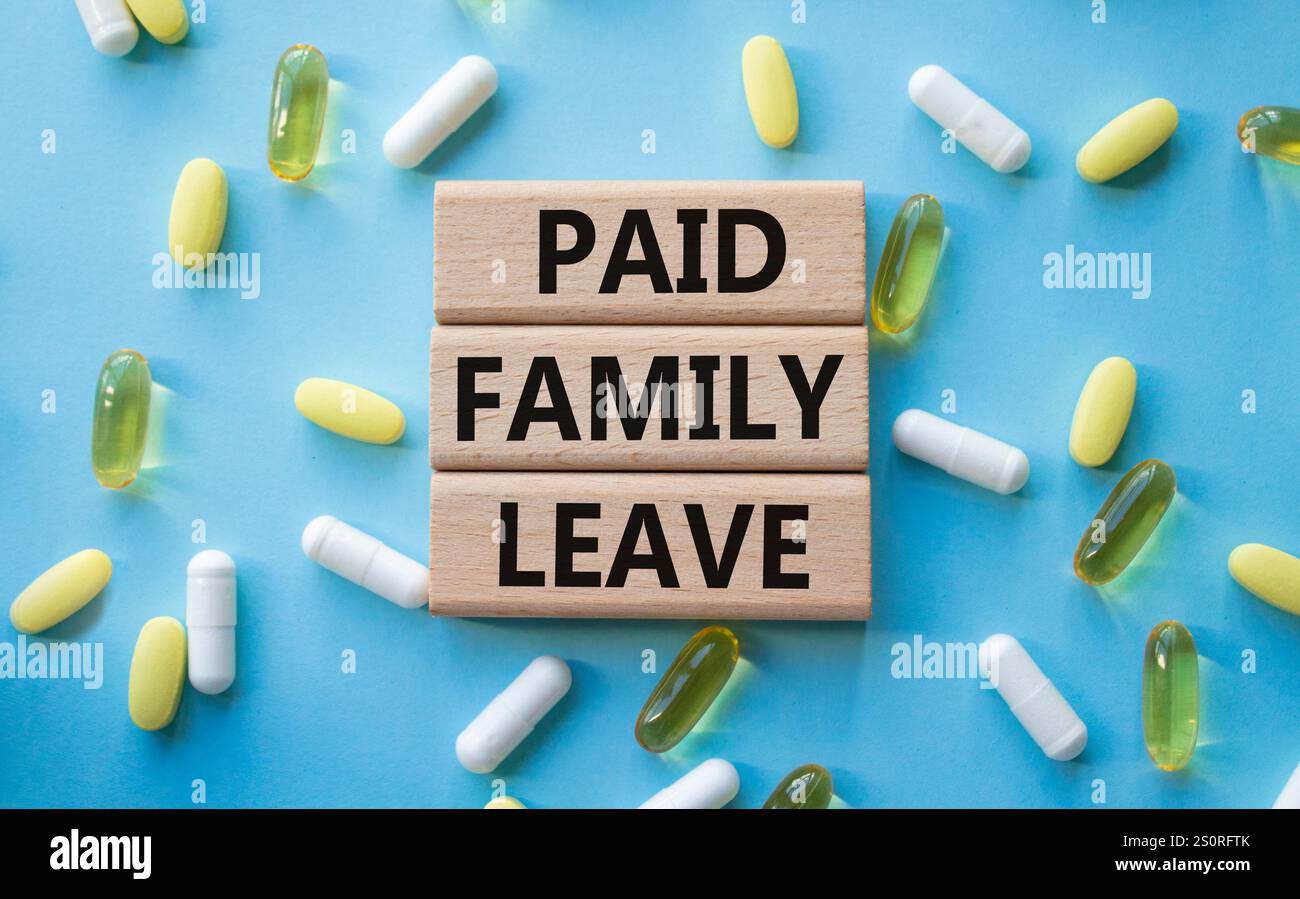 Paid Family Leave symbol. Concept words Paid Family Leave on wooden ...