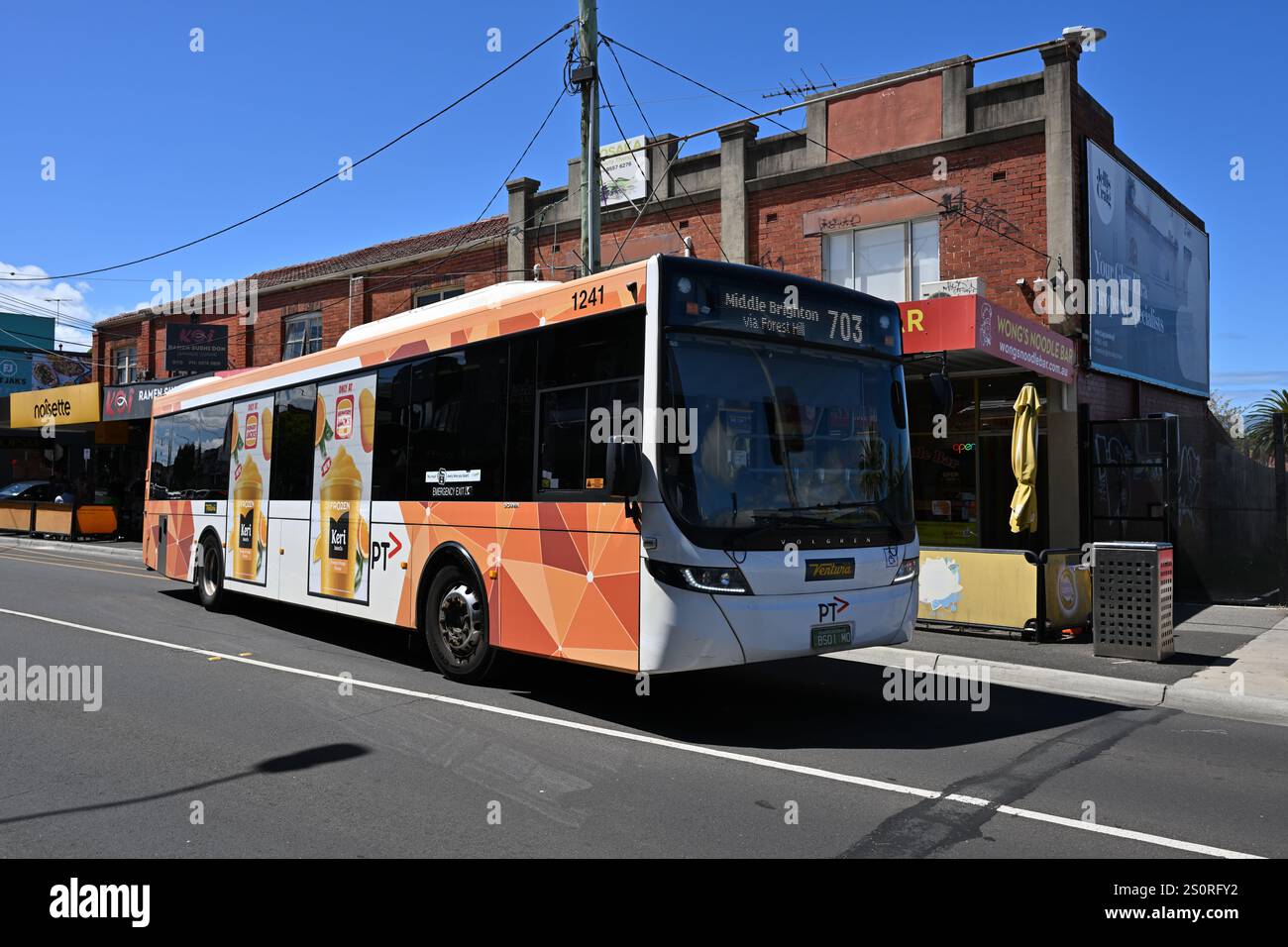 Route 703 bus, a Scania K310UB operated by Ventura, travelling past Centre Rd shops and ...