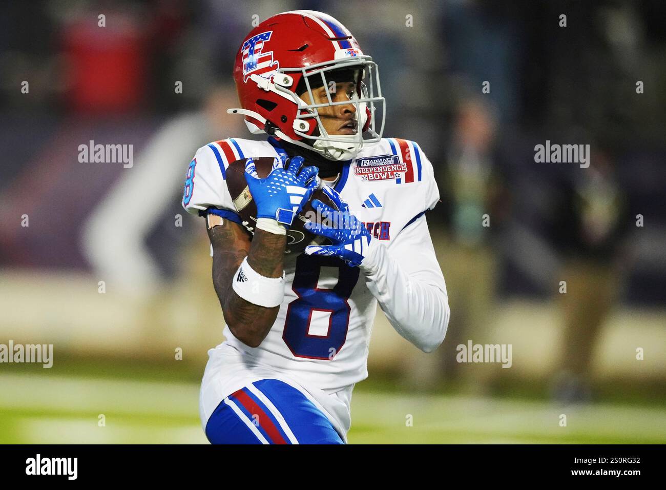 Louisiana Tech wide receiver Devonta Lee (8) cradles the ball from an Army kickoff during the ...