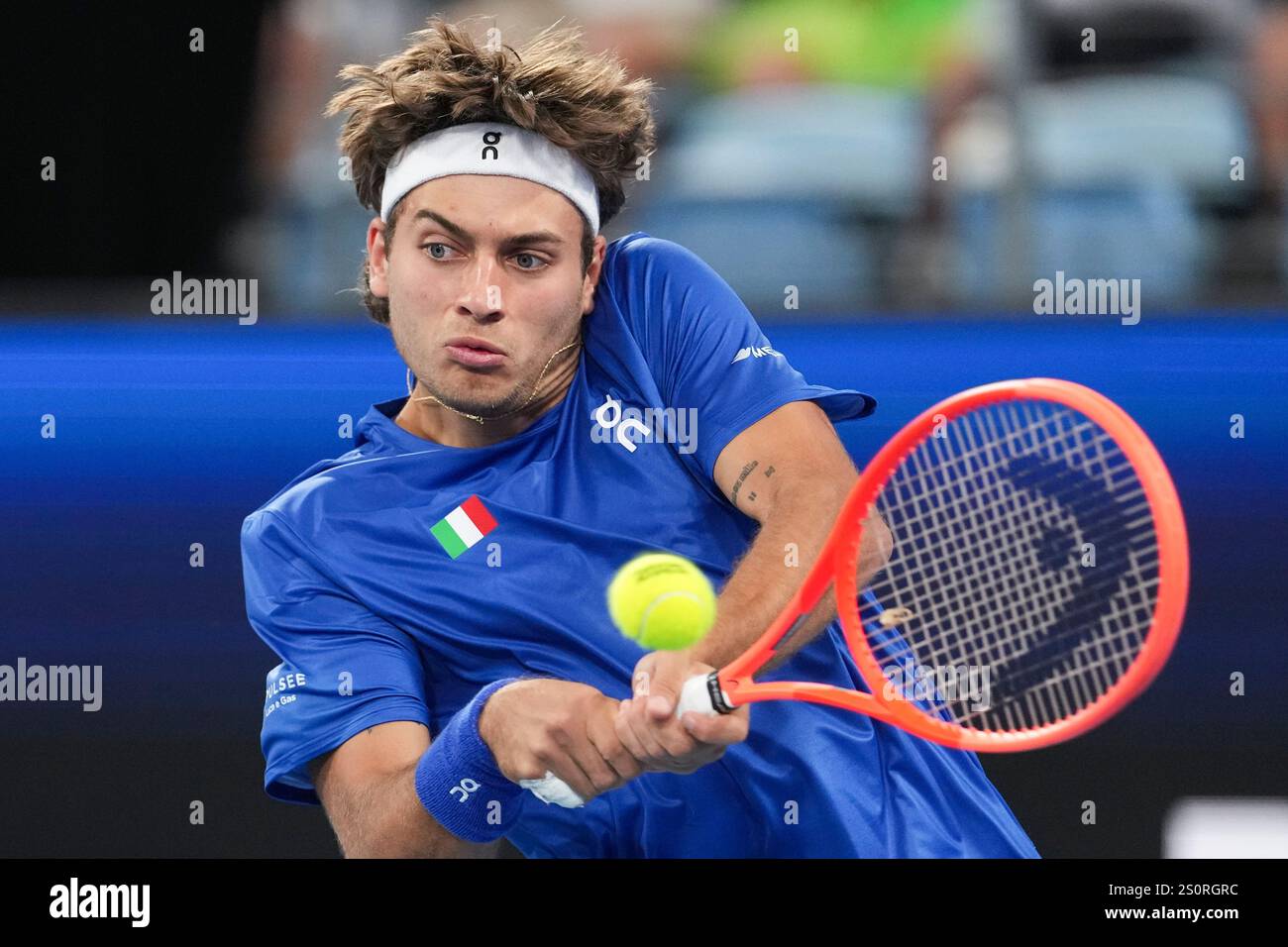 Italy's Flavio Cobolli plays a backhand return to toSwitzerland's ...