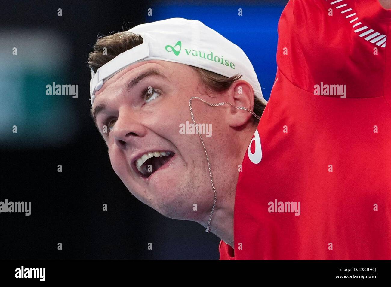 Switzerland's Dominic Stricker serves to Italy's Flavio Cobolli during ...