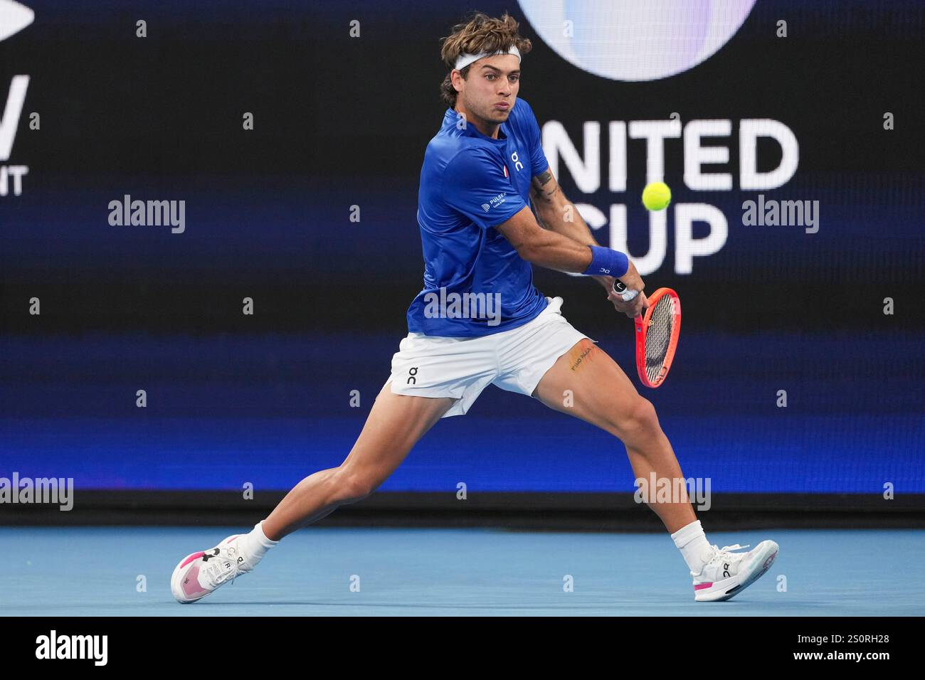 Italy's Flavio Cobolli plays a backhand return to Switzerland's Dominic ...