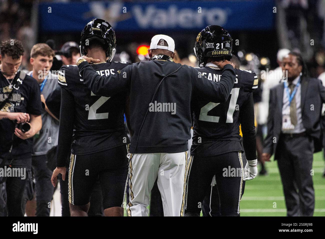 December 28, 2024: University of Colorado head coach Deion Sanders hugs ...